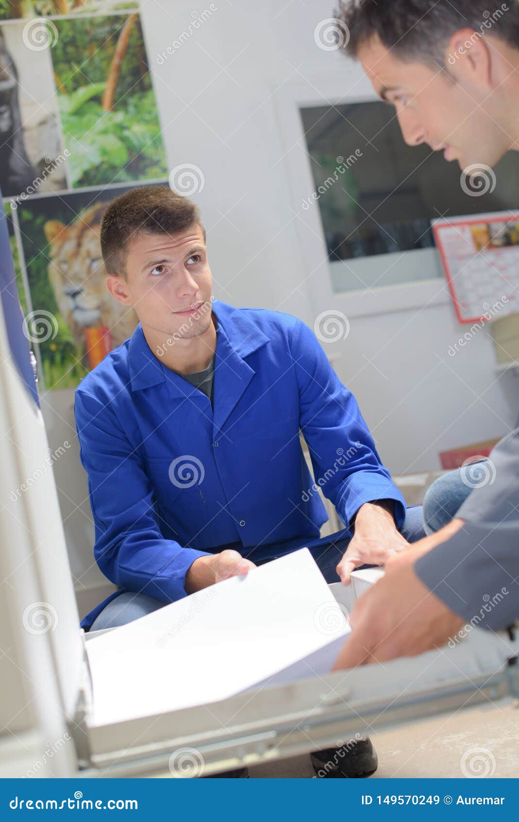 Two Men Loading Paper into Printer Stock Image - Image of people ...