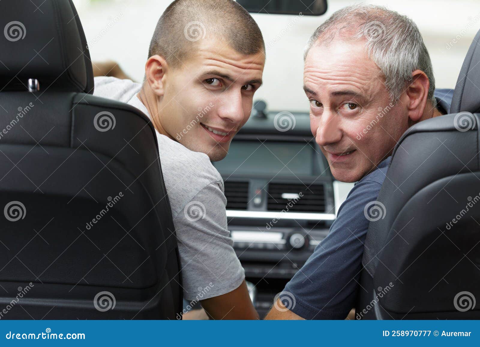 Two Men Looking Back and Smiling Stock Image - Image of people ...