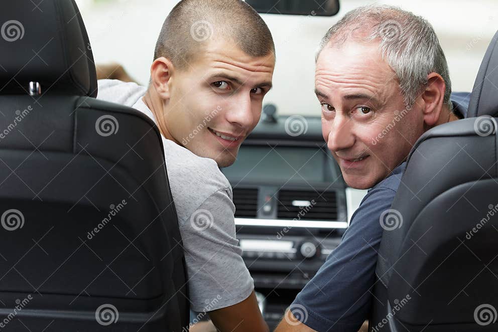 Two Men Looking Back and Smiling Stock Image - Image of people ...