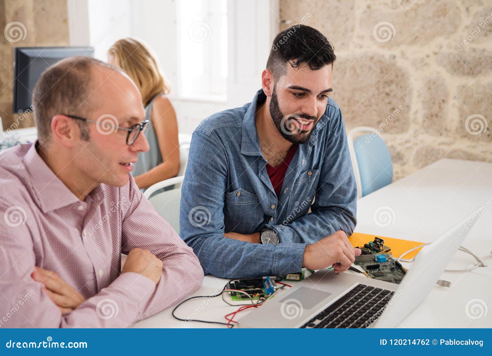 Two Men Looking at a Laptop and Smiling Stock Photo - Image of talking ...