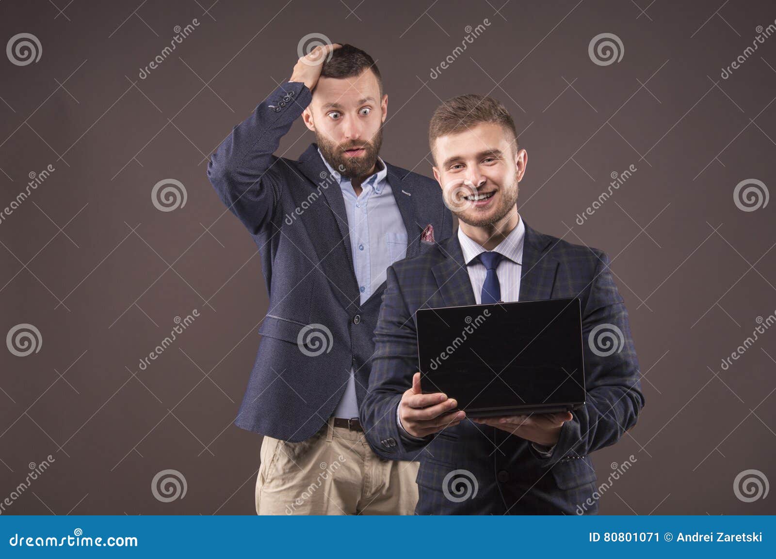 Two men looking at laptop stock image. Image of professional - 80801071