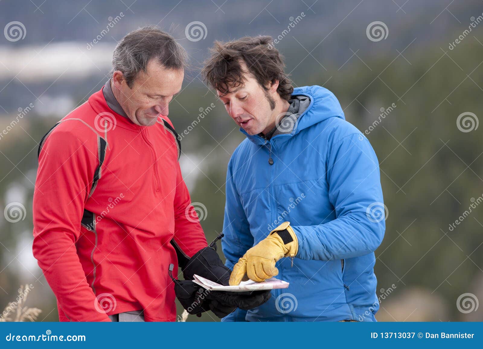 Two Men Looking at Map in the Wilderness Stock Image - Image of holding ...