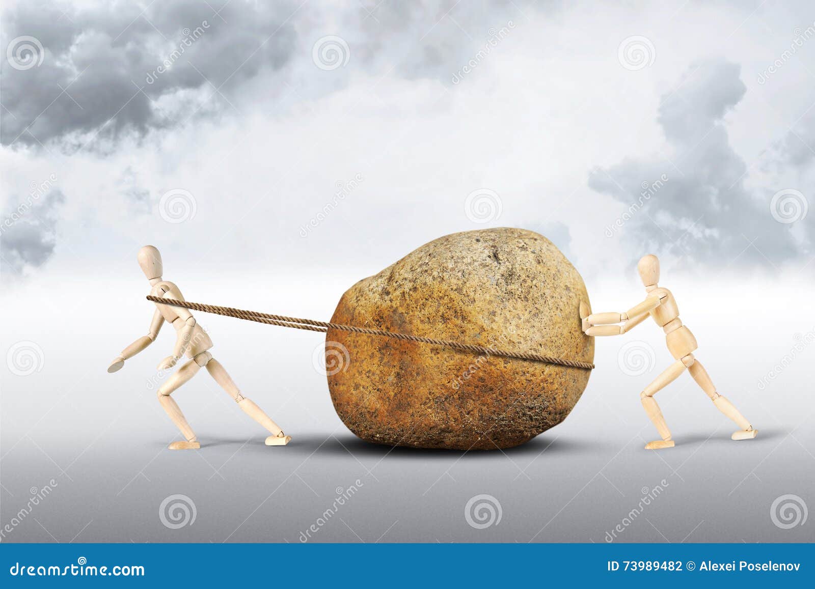 Two men move a huge stone stock photo. Image of cooperate - 73989482