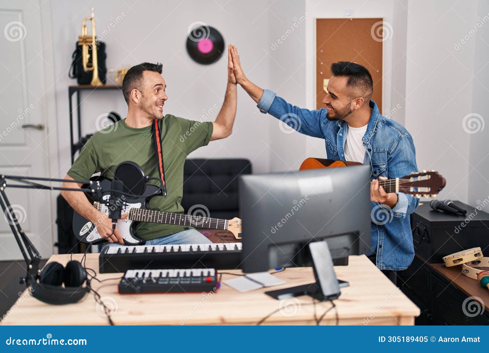 Two Men Musicians Smiling Confident High Five with Hands Raised Up at ...