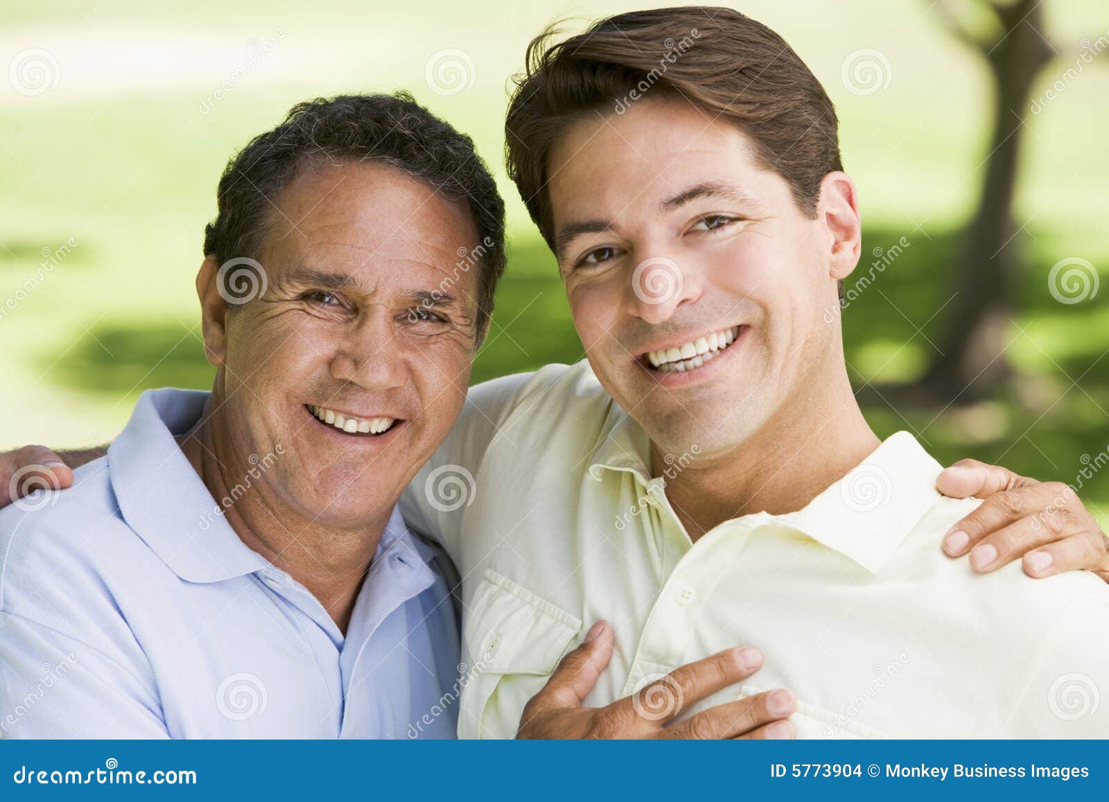 Two Men Outdoors Embracing and Smiling Stock Photo - Image of aged ...