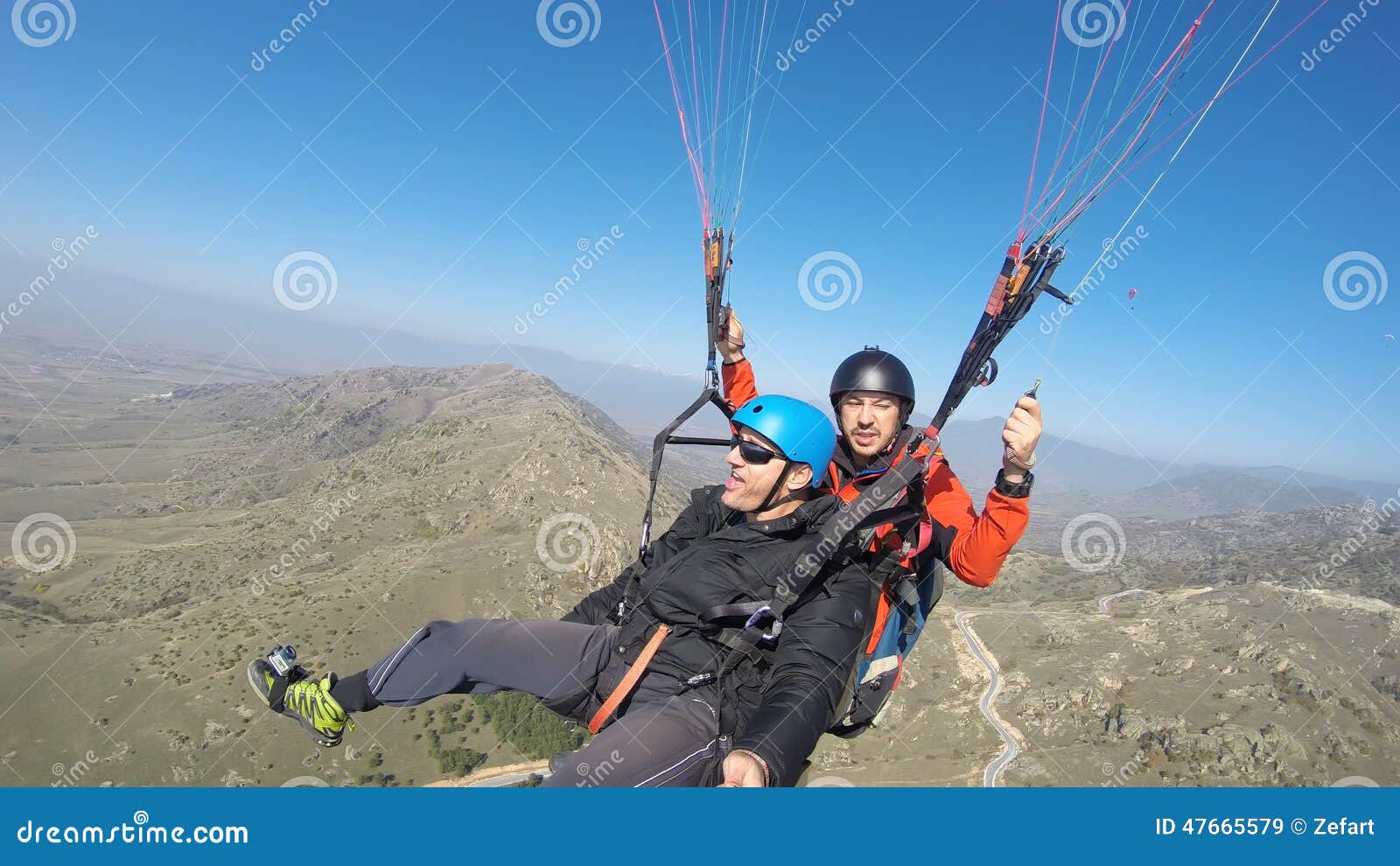 Two men paragliding stock image. Image of hanggliders - 47665579