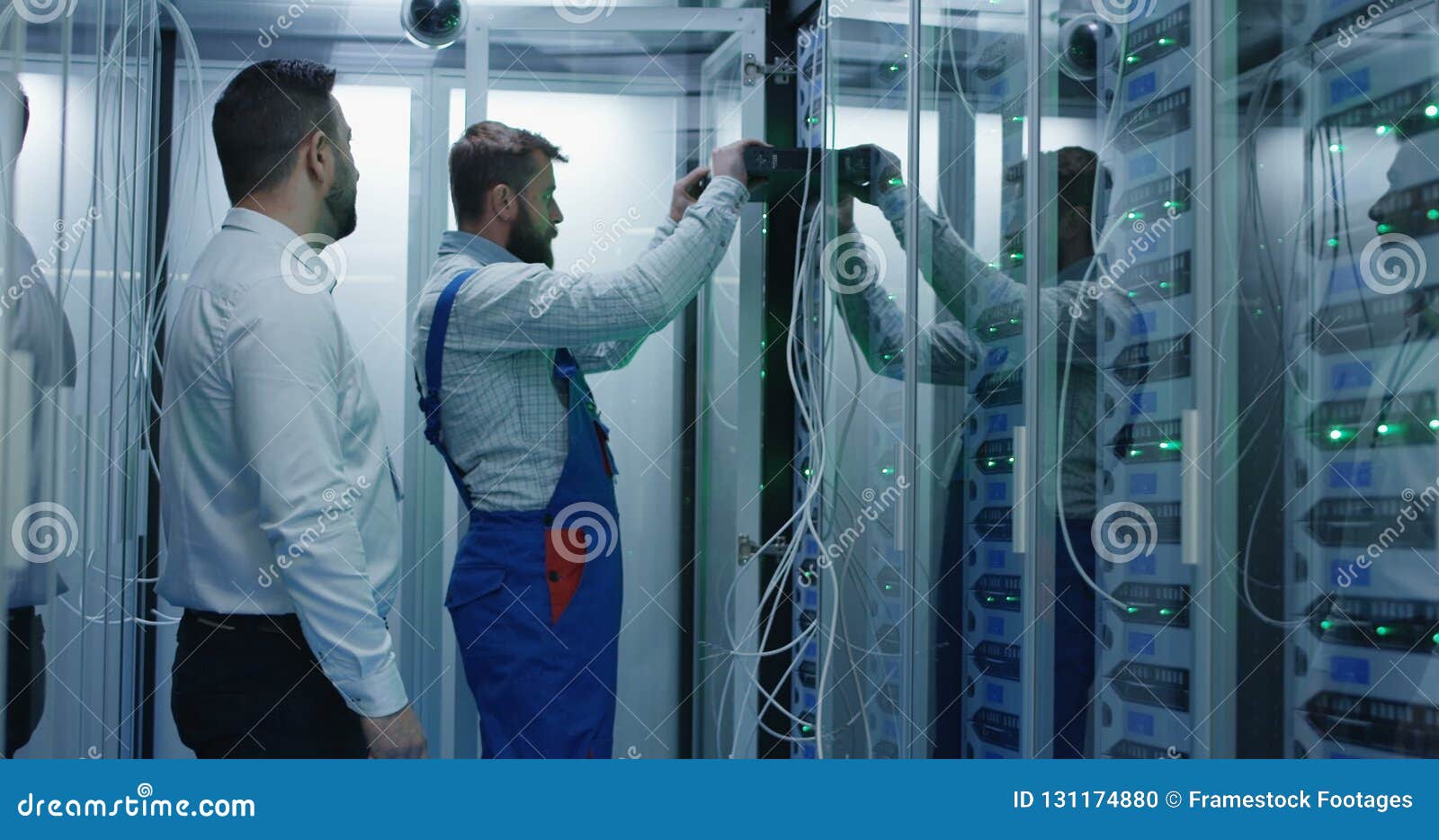 Two Men Performing Maintenance in a Data Center Stock Footage - Video ...