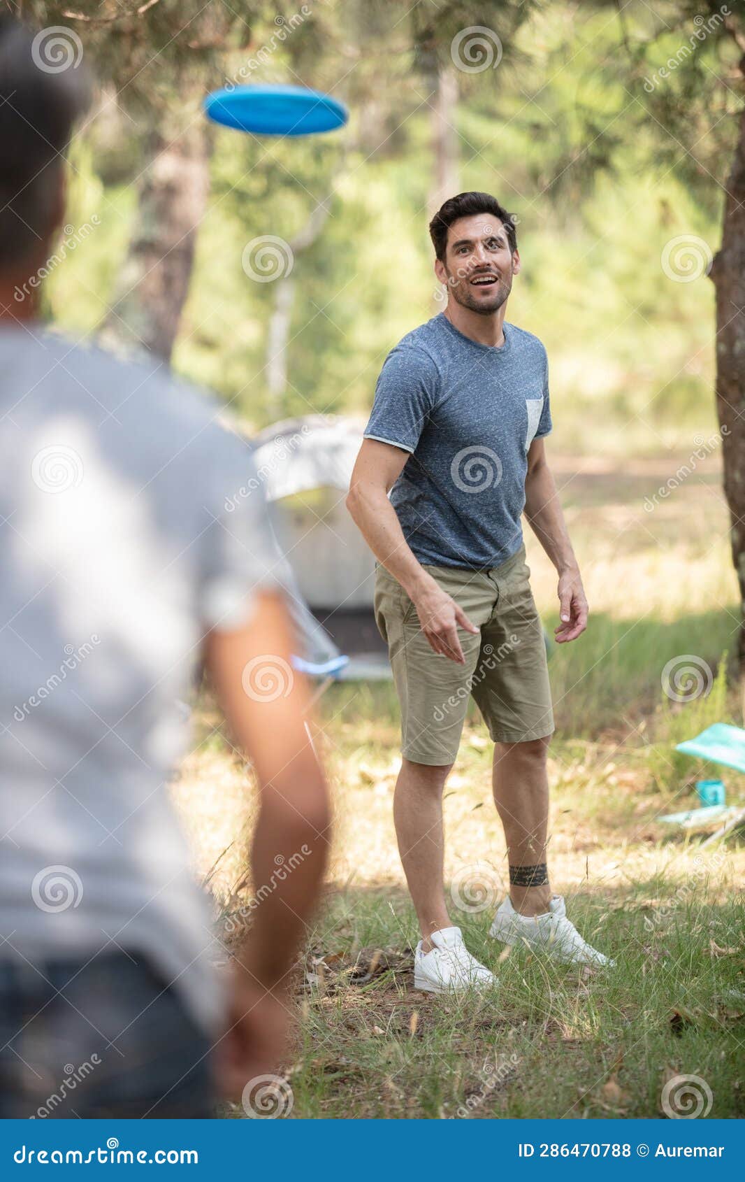 Two men playing frisbee stock photo. Image of ultimatefrisbee - 286470788