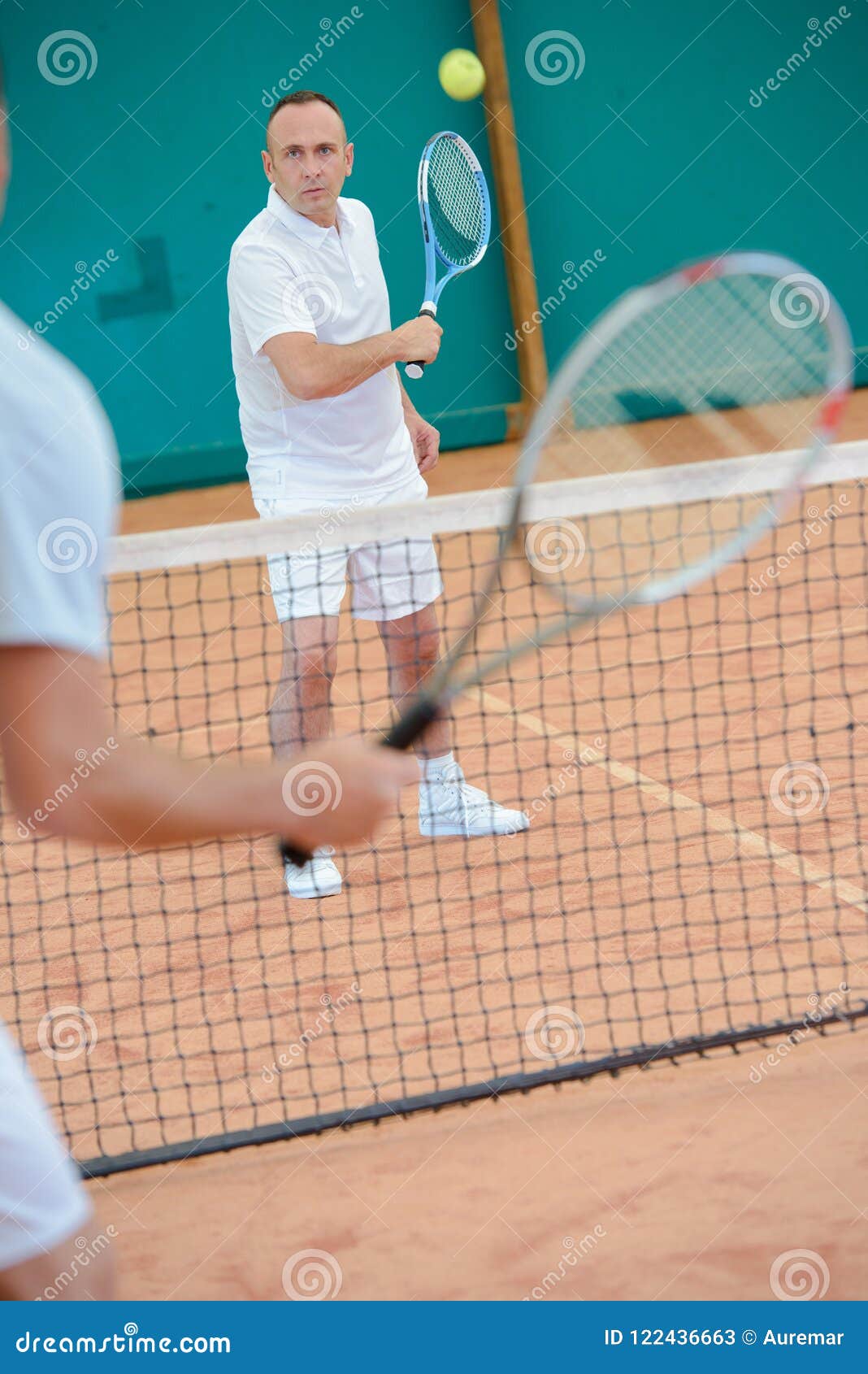 Two men playing tennis stock image. Image of competition - 122436663