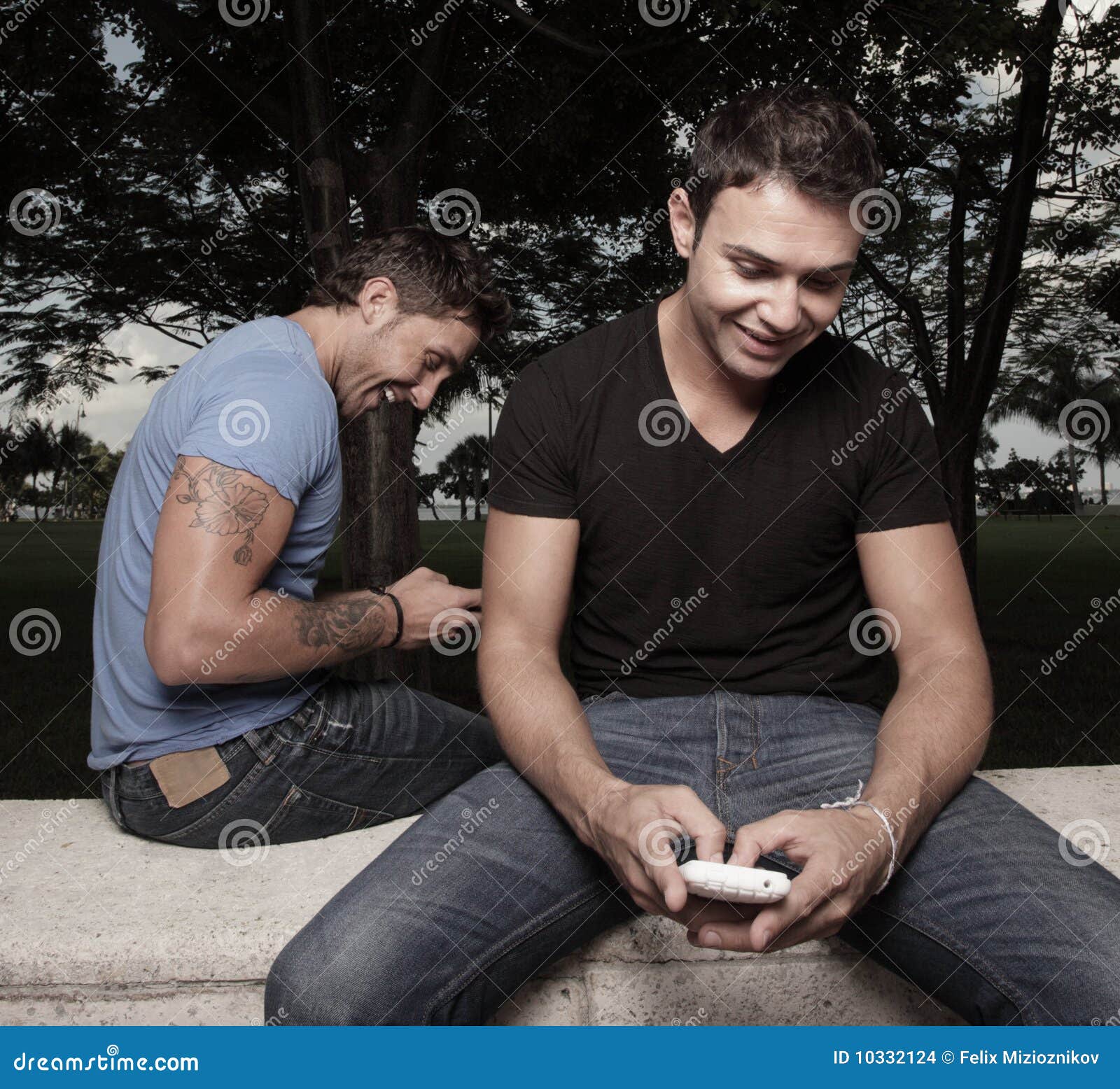 Two Men Playing with Their Phones Stock Photo - Image of electronics ...