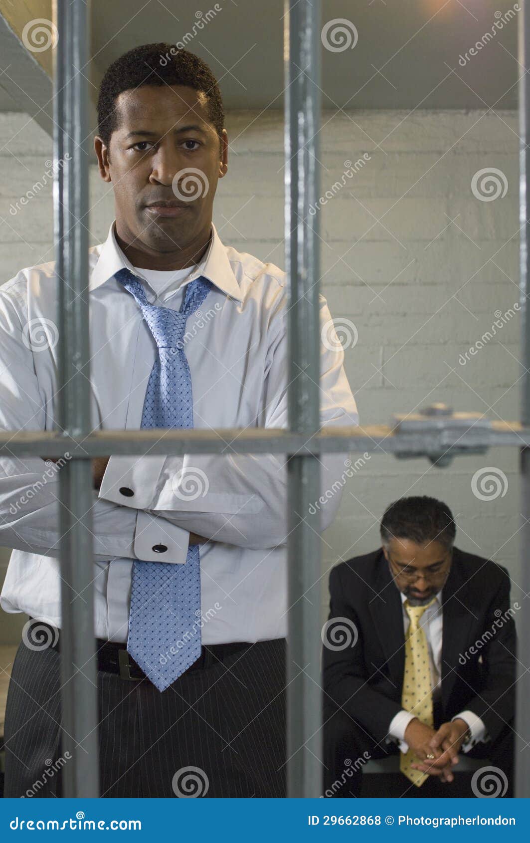 Two Men in Prison Cell stock photo. Image of businessmen - 29662868