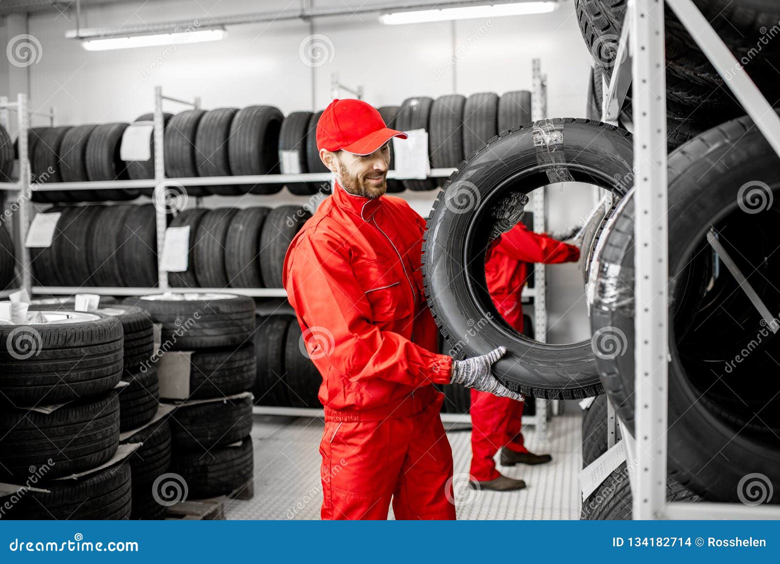 Men Working in the Warehouse with Tires Stock Photo - Image of black ...
