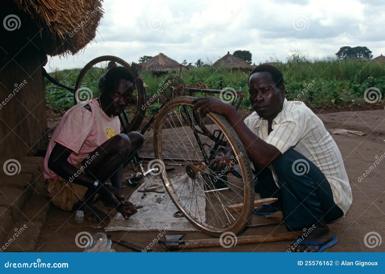 Two Men Repairing a Bicycle, Malawi. Editorial Photography - Image of ...