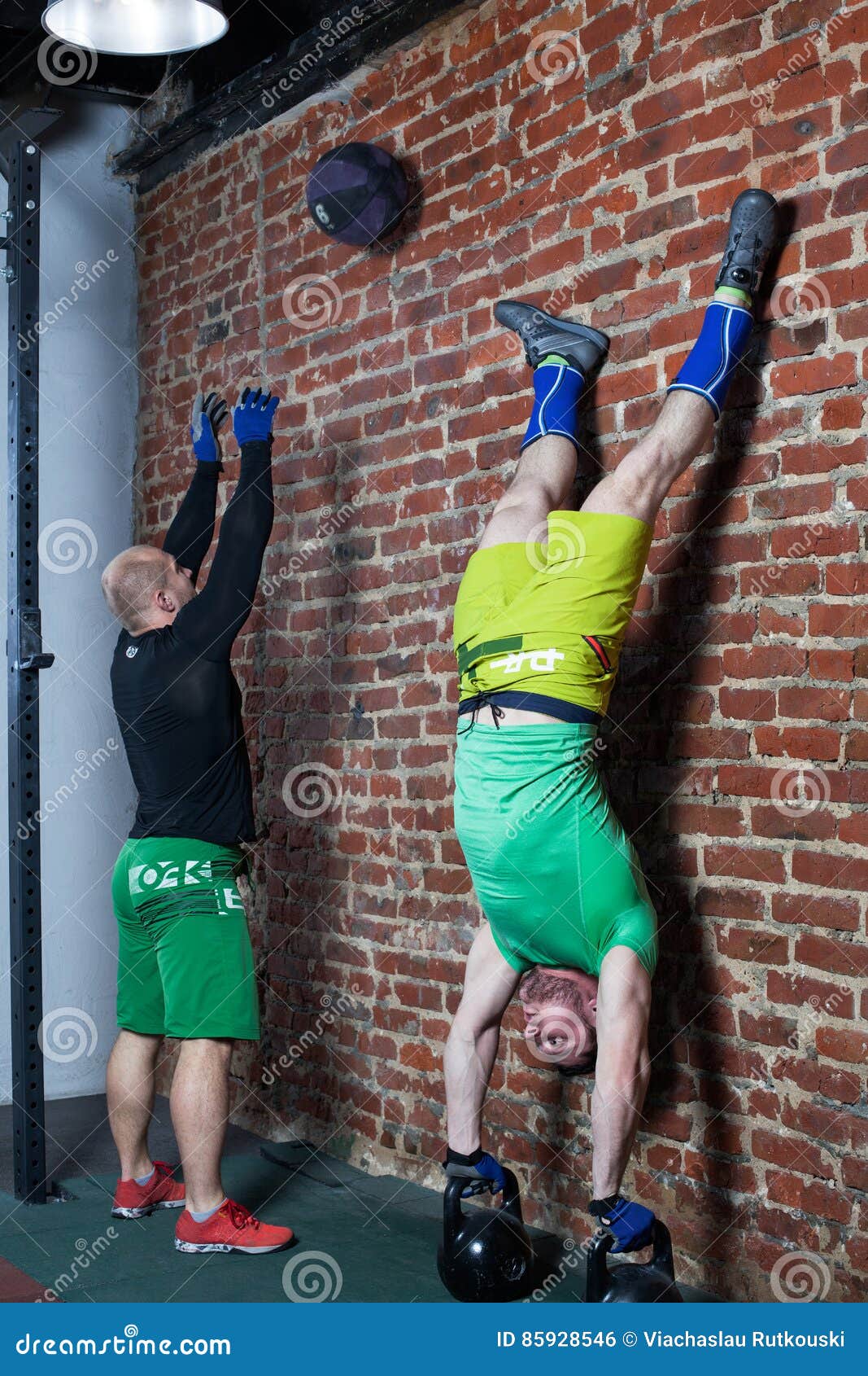 Two Men are Repforming Handstand Stock Photo - Image of young, team ...