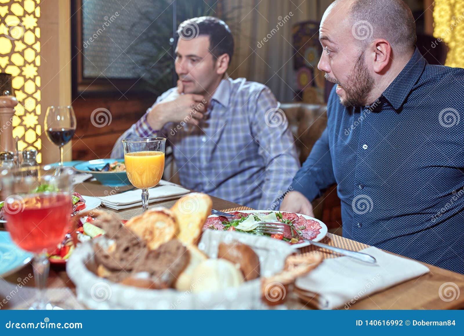 Two Men in a Restaurant Arguing during Lunch Stock Photo - Image of ...