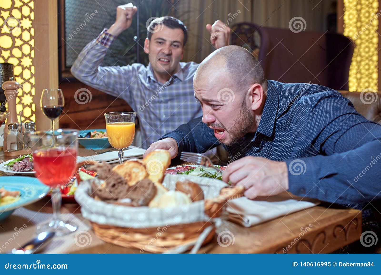 Two Men in a Restaurant Arguing during Lunch Stock Image - Image of ...