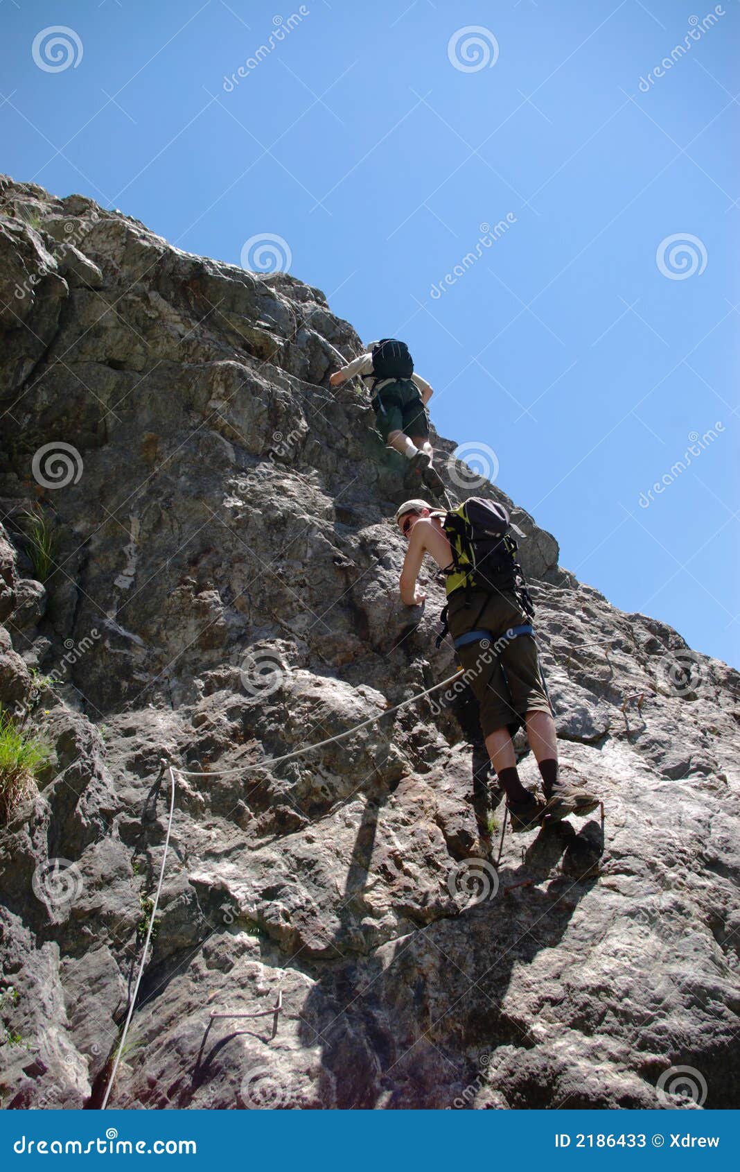 Two men rock climbing stock image. Image of blue, mountaineering - 2186433
