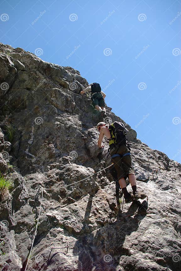 Two men rock climbing stock image. Image of blue, mountaineering - 2186433