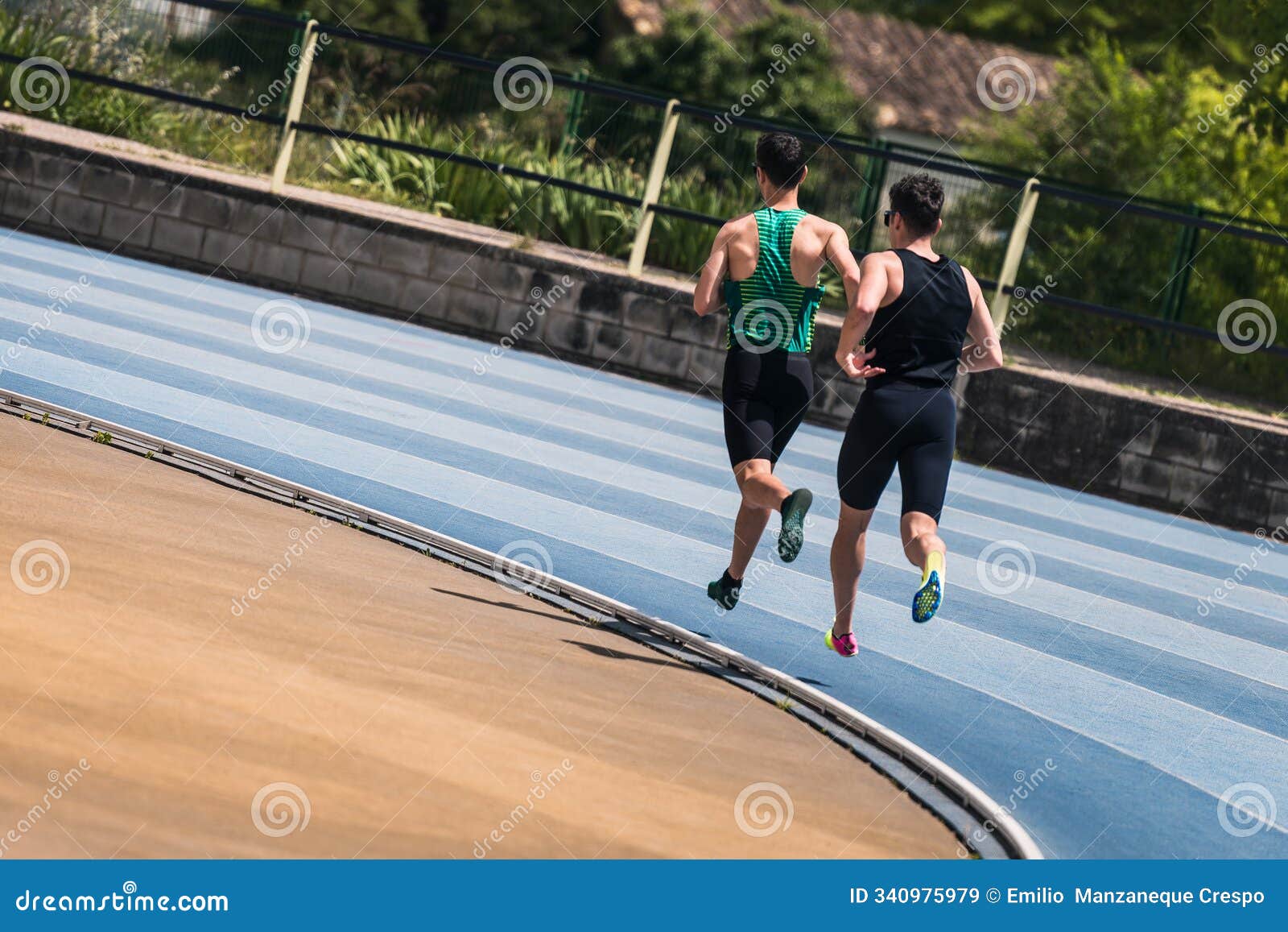 Two Men Run on a Blue Running Track Stock Image - Image of caucasian ...