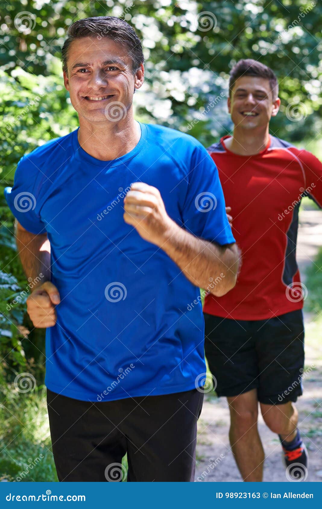Two Men Running in Countryside Together Stock Image - Image of happy ...