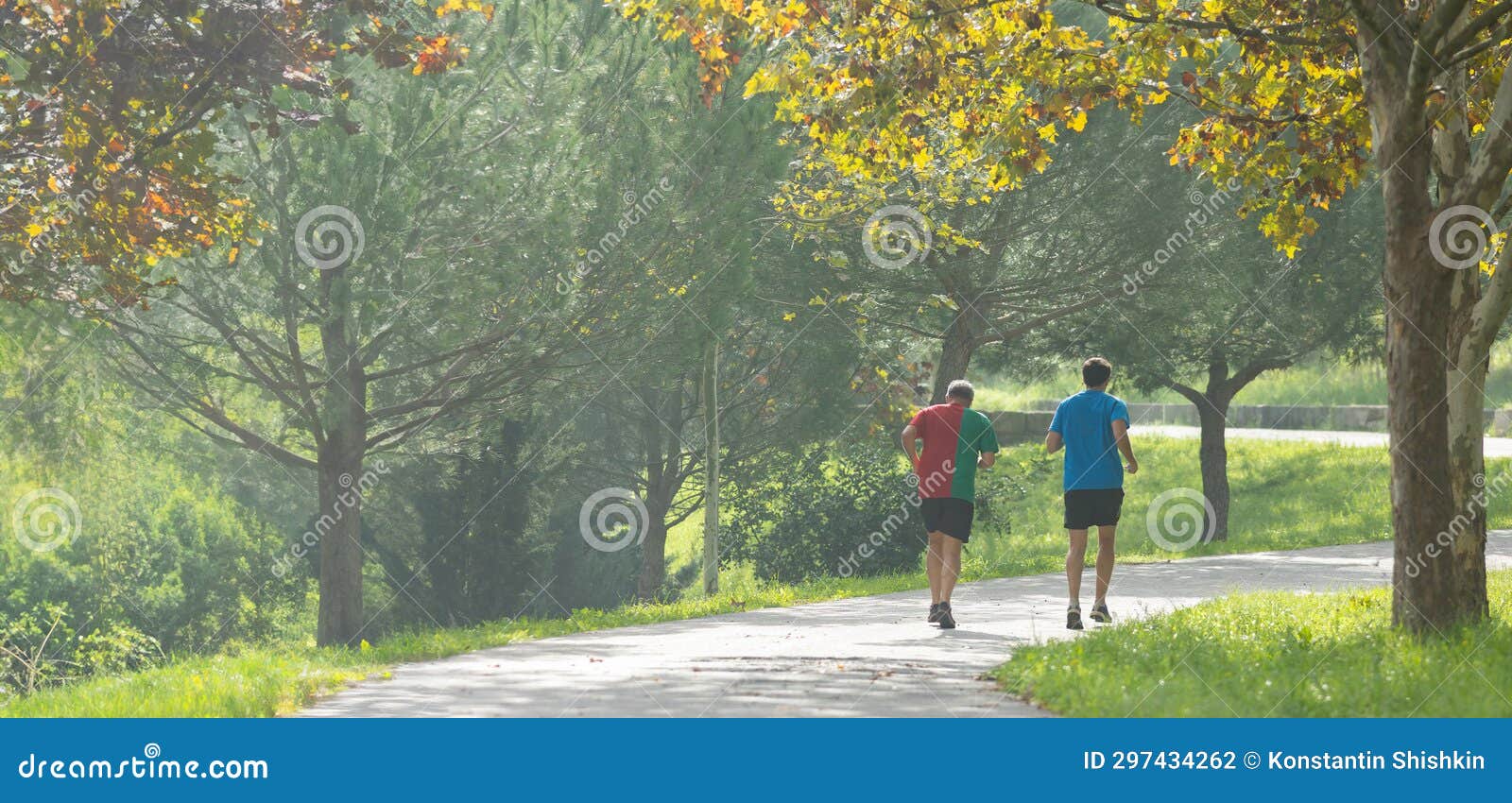 Two Men Running in the Green Park Stock Photo - Image of peaceful ...