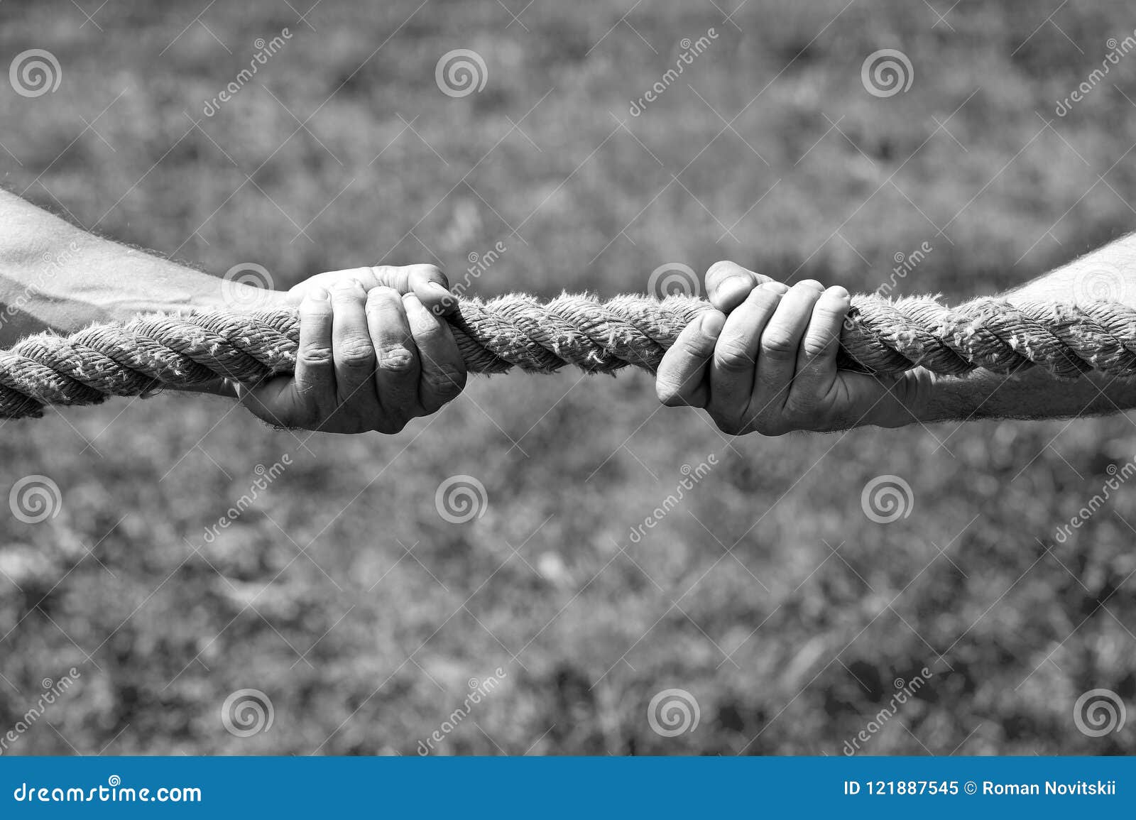 Two Men`s Hands Pull the Rope Each in His Own Direction. the Concept of ...