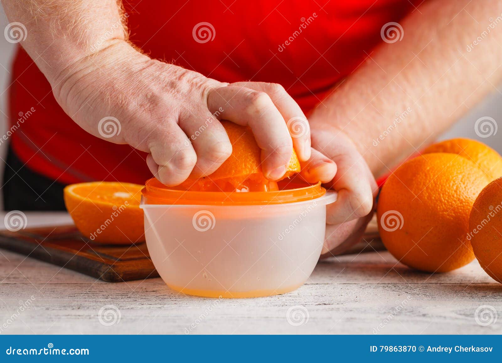 Two Men S Hands Squeezing the Juice from a Orange Stock Photo - Image ...