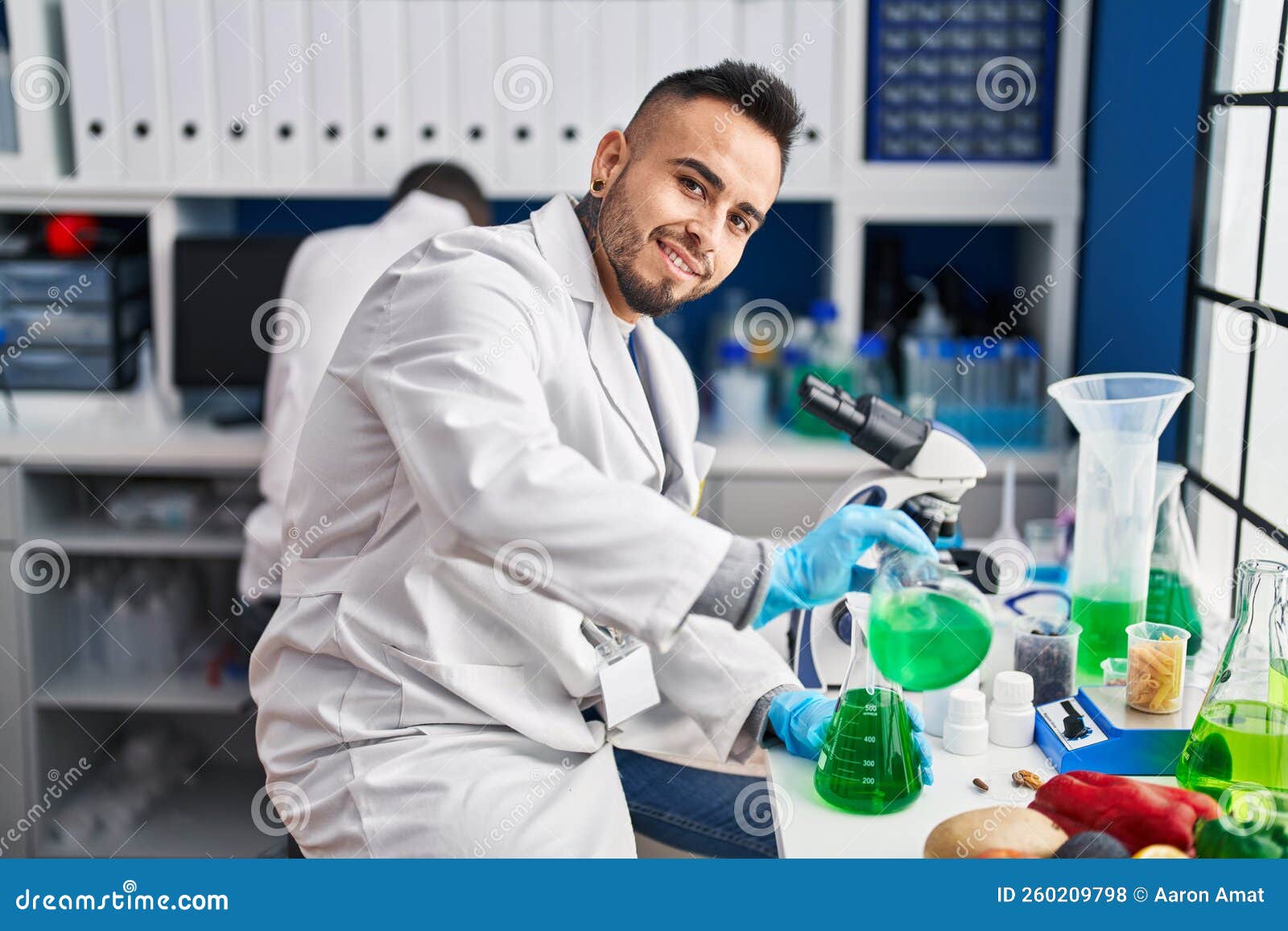 Two Men Scientists Pouring Liquid on Test Tube at Laboratory Stock ...