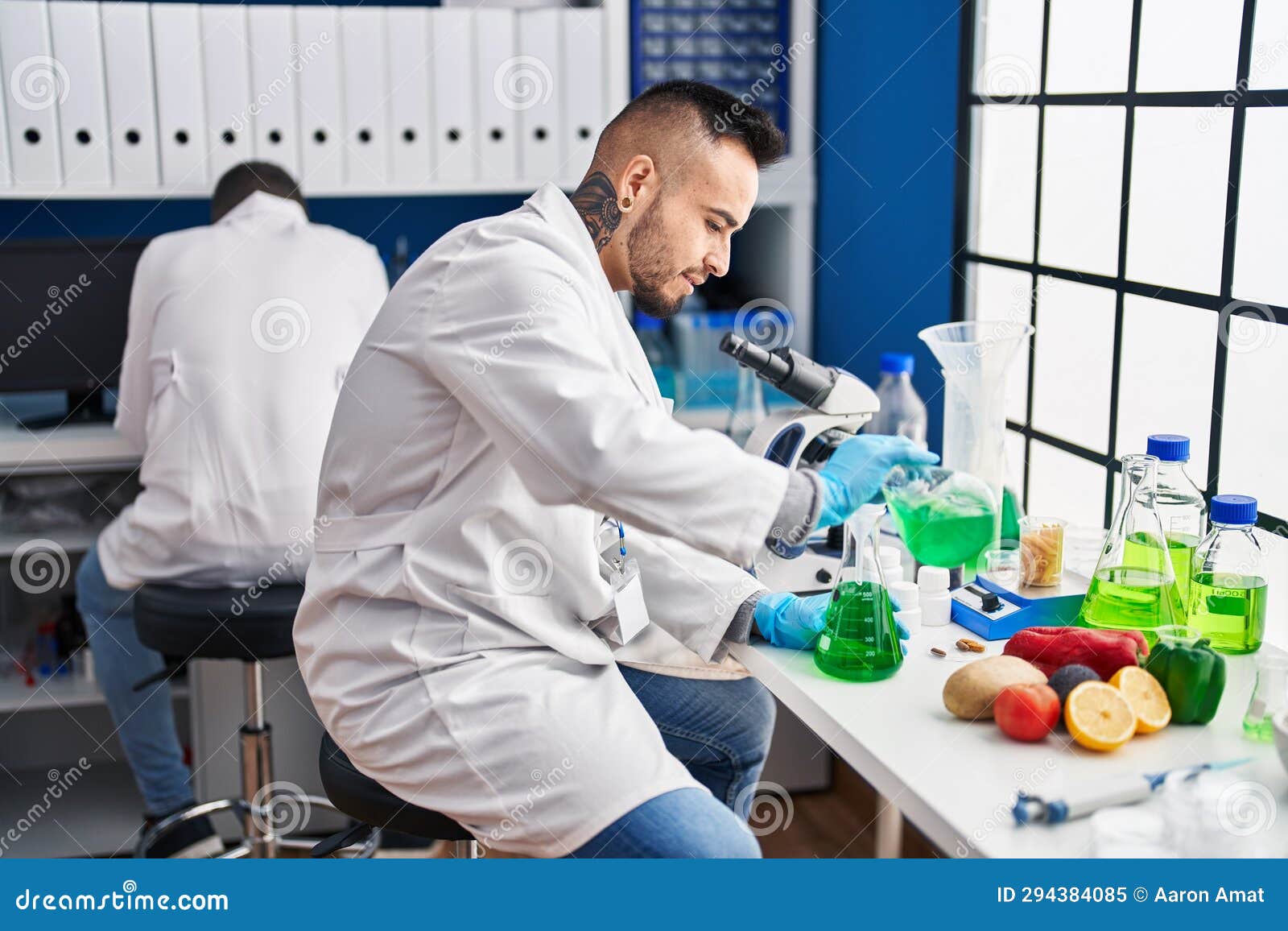Two Men Scientists Pouring Liquid on Test Tube at Laboratory Stock ...