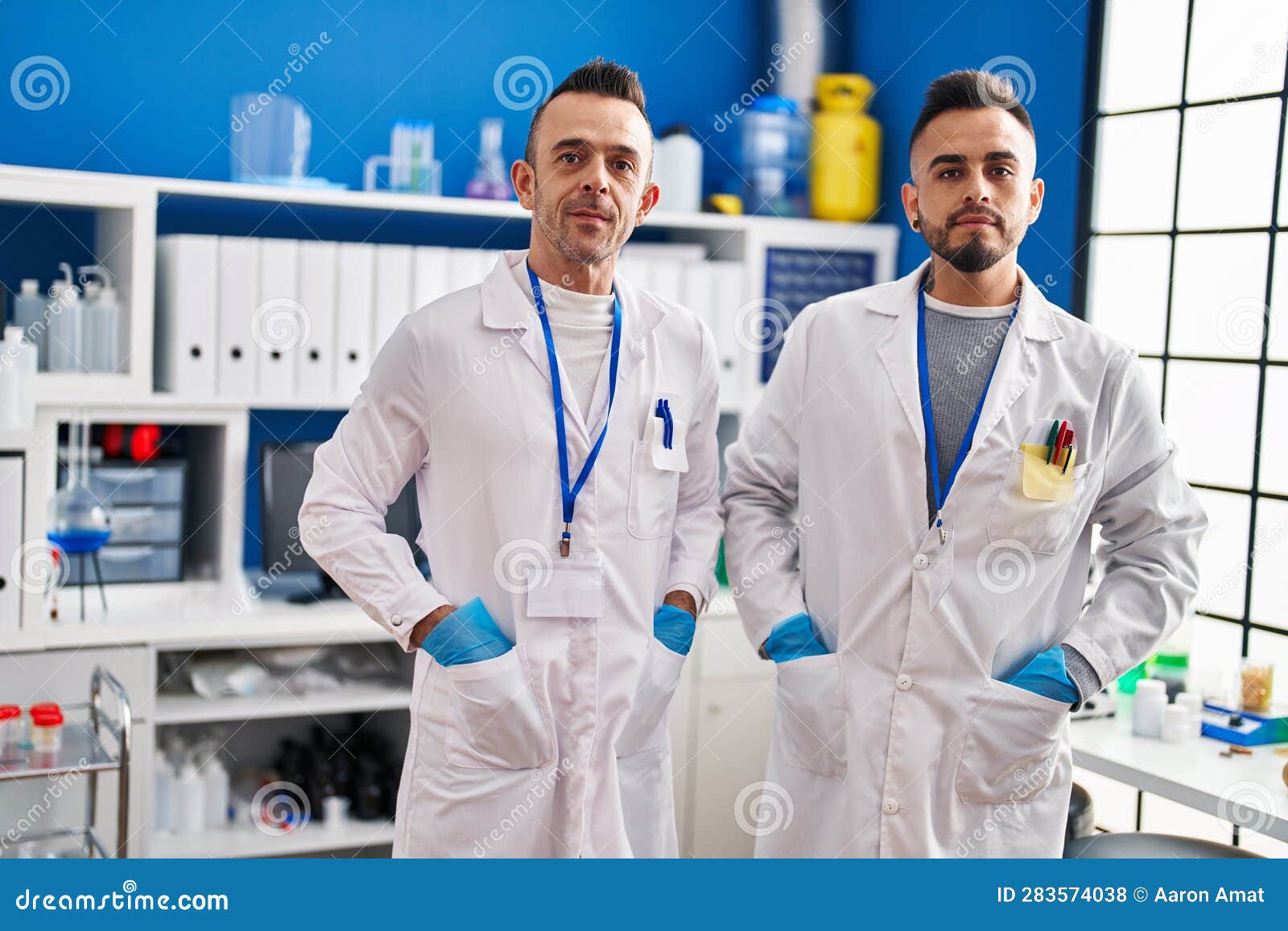 Two Men Scientists Standing with Relaxed Expression at Laboratory Stock ...