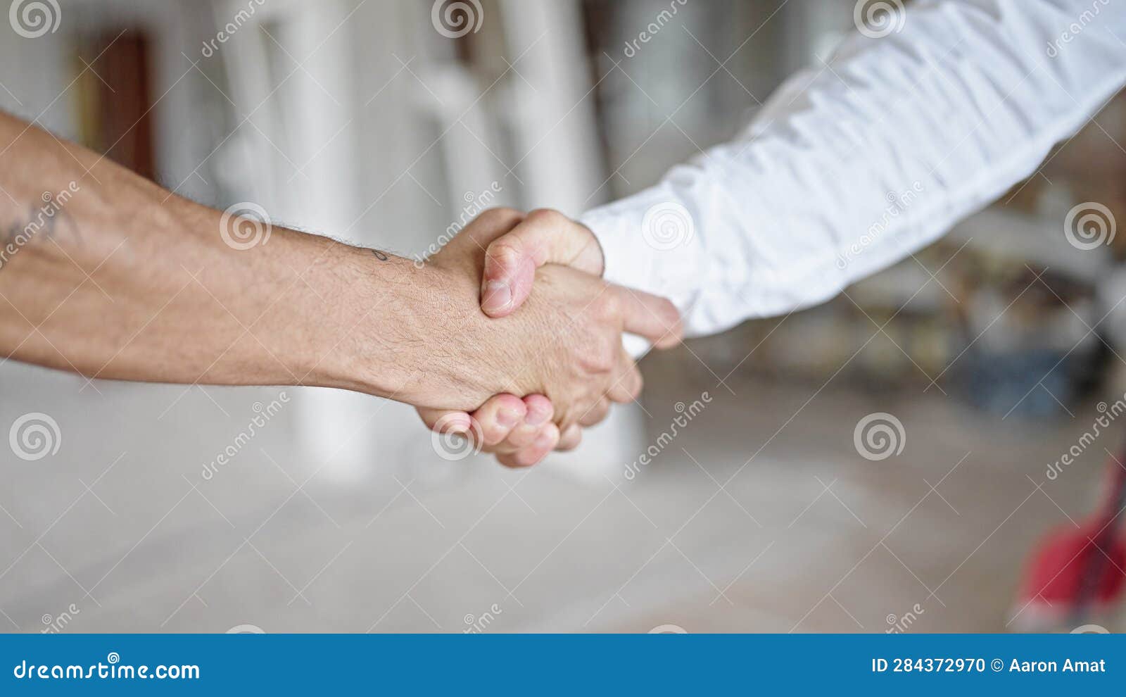 Two Men Shake Hands at Construction Site Stock Photo - Image of apartment, family: 284372970