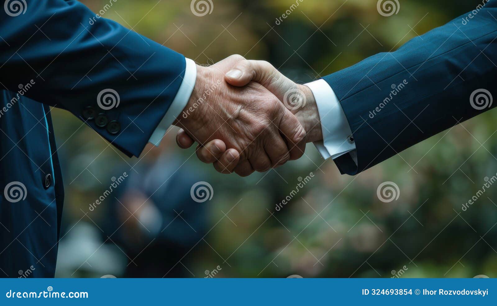 Two Men Shaking Hands. Signing an Important Agreement. Stock ...