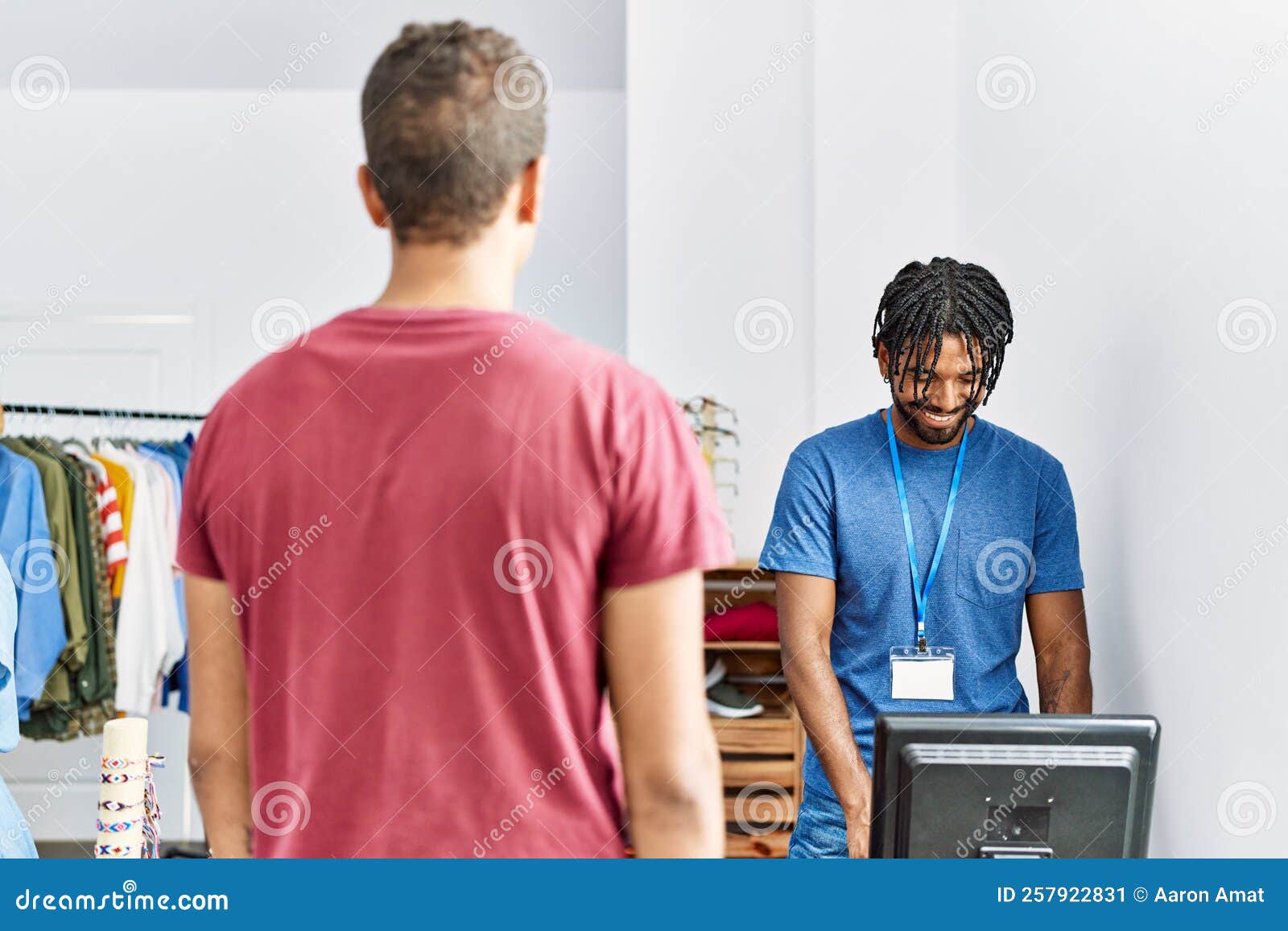 Two Men Shopkeeper and Customer Standing at Clothing Store Stock Image ...