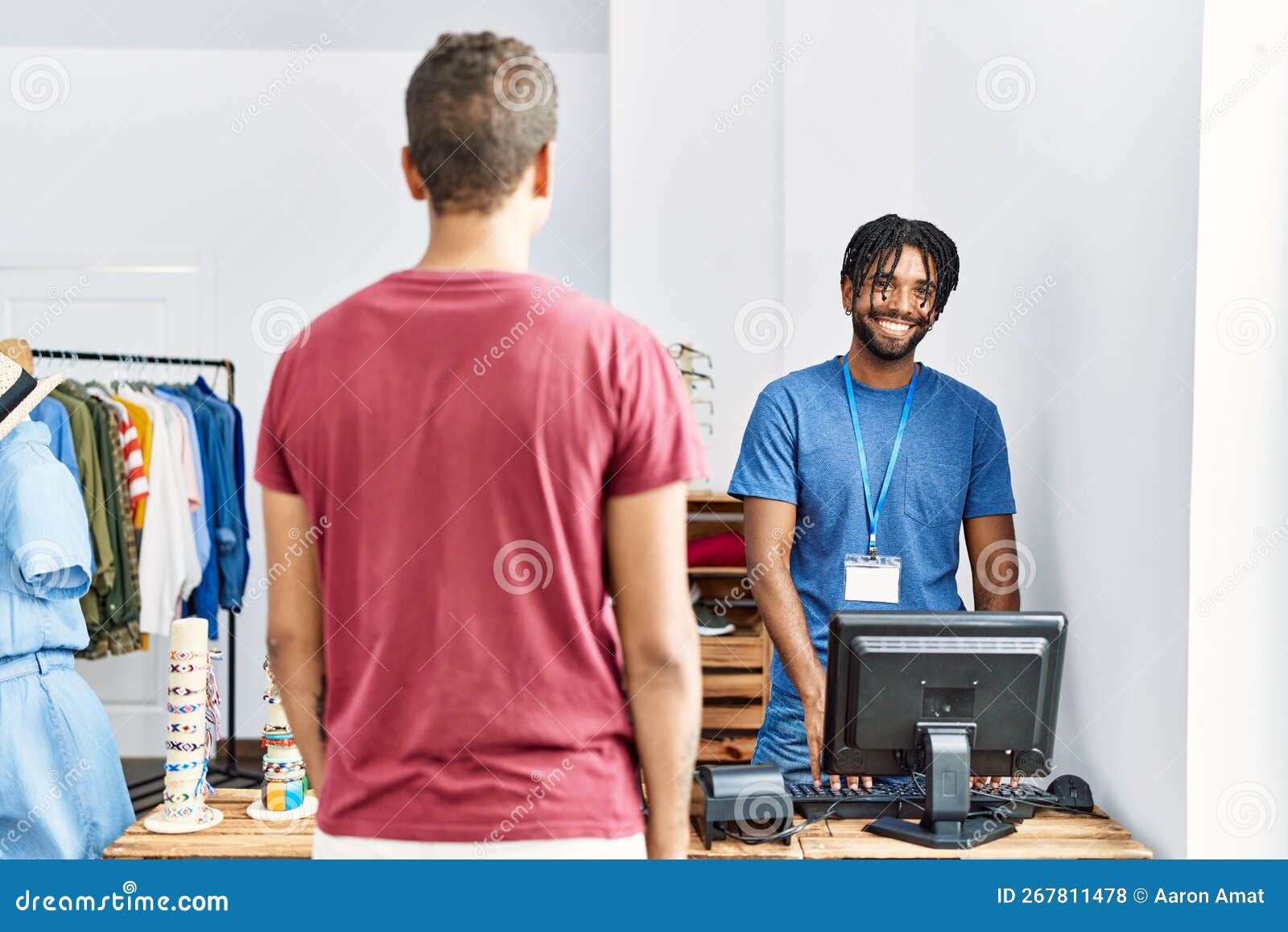 Two Men Shopkeeper and Customer Standing at Clothing Store Stock Photo ...