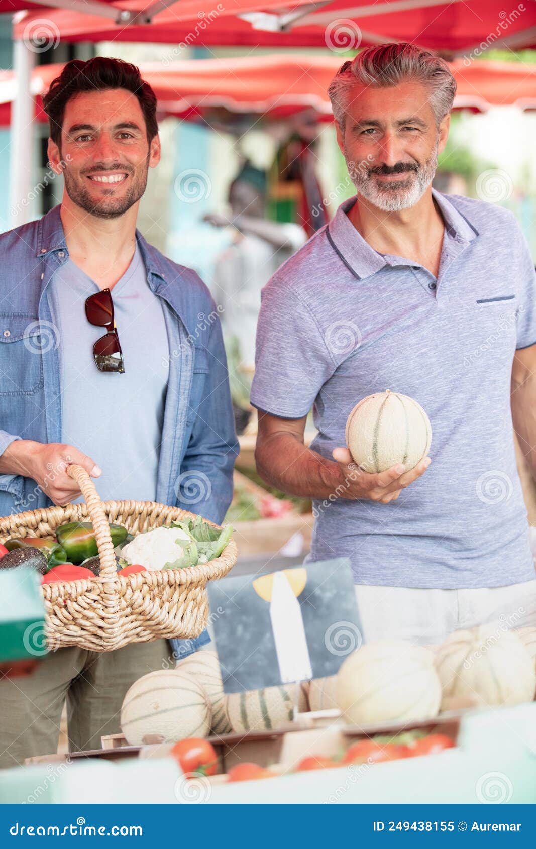 Two men shopping in market stock image. Image of holding - 249438155