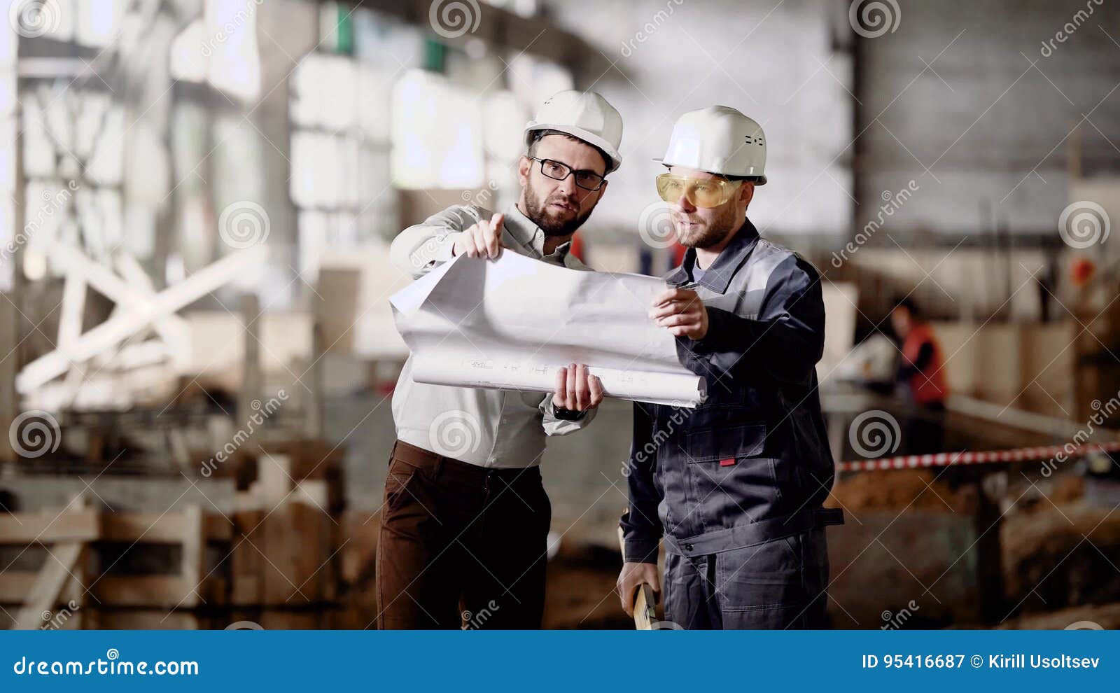 Two Men on Site Discussing Project Plan. Side View of Workers in Hard ...