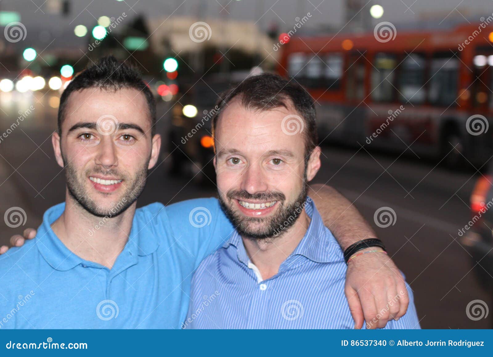 Two Men Smiling Walking the City Streets at Night Stock Photo - Image ...