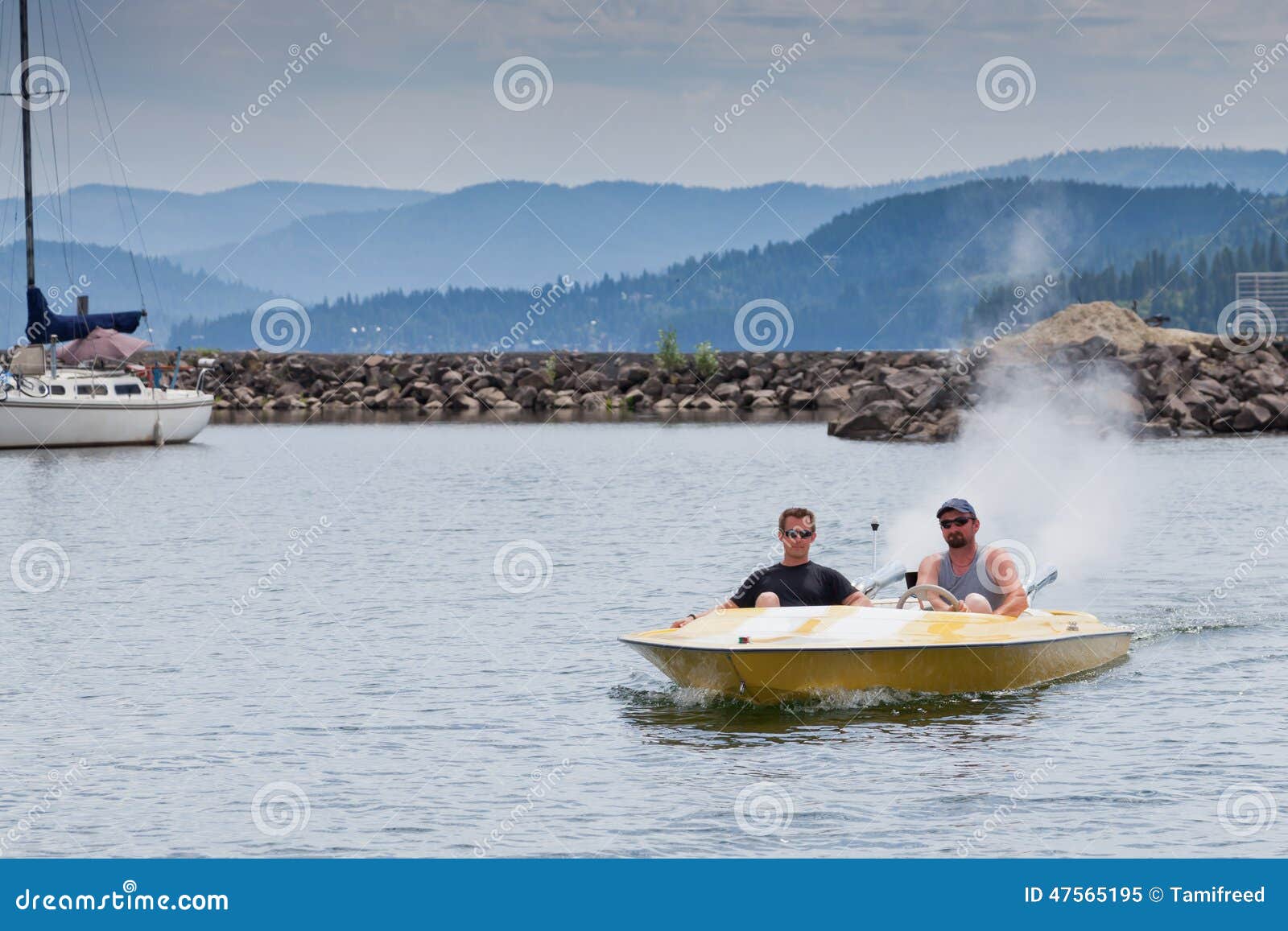 Two Men in a Speedboat stock image. Image of discover - 47565195