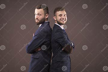 Two Men Standing Back To Back Stock Image - Image of confidence, people ...