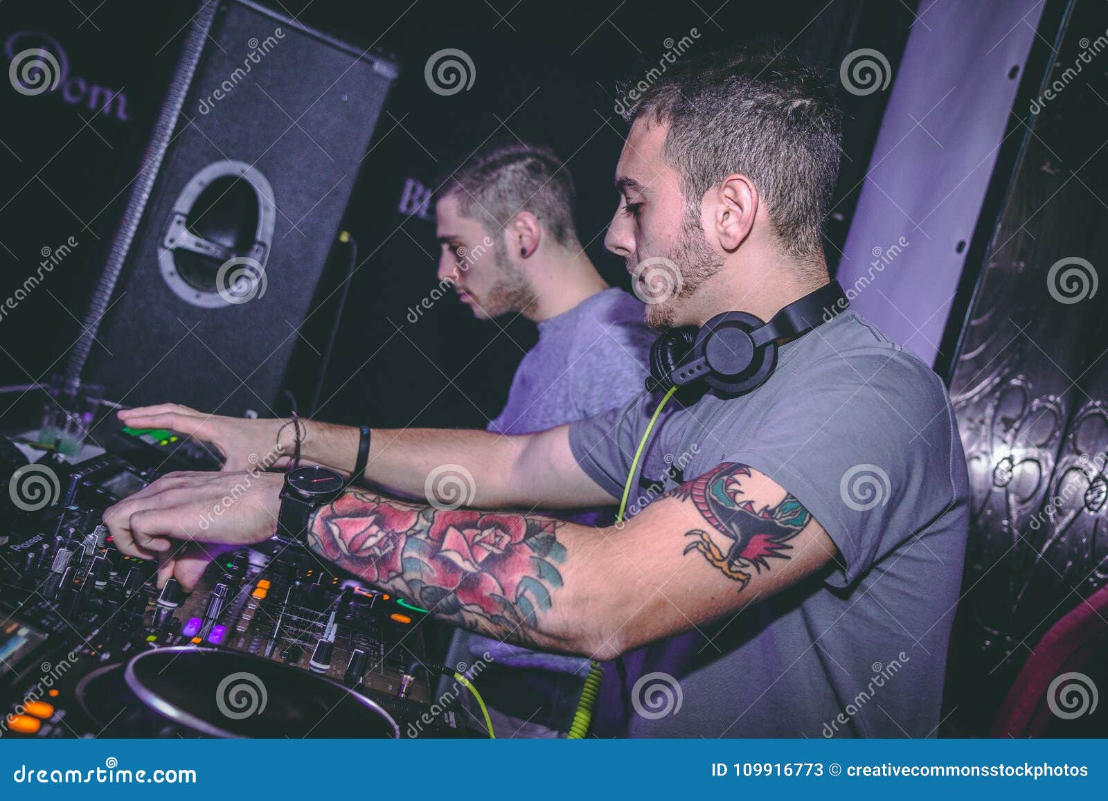 Two Men Standing In Front Dj Mixer Picture. Image: 109916773