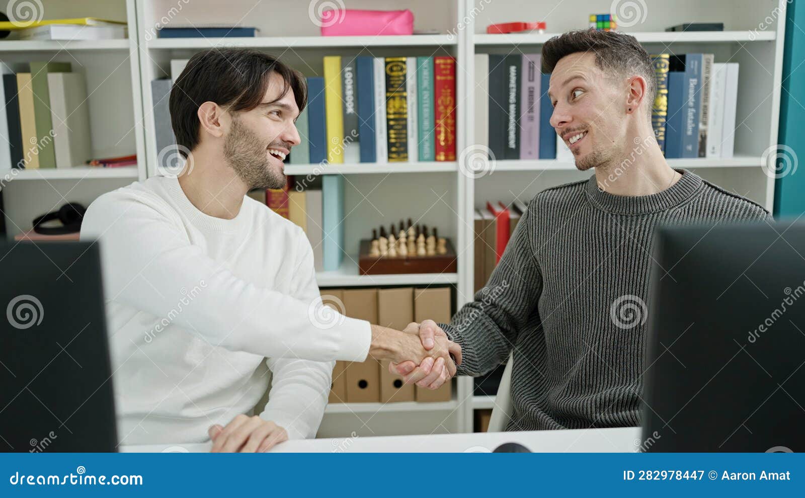 Two Men Students Shake Hands Studying at Library University Stock Image ...