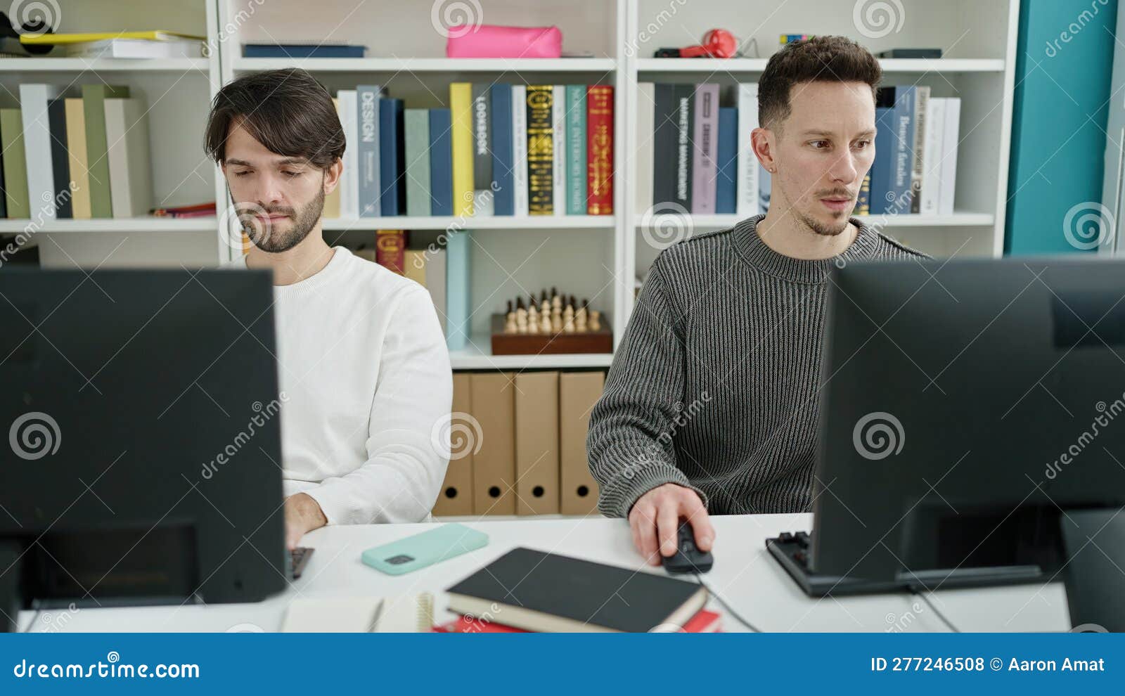 Two Men Students Using Computer Studying at Library University Stock ...
