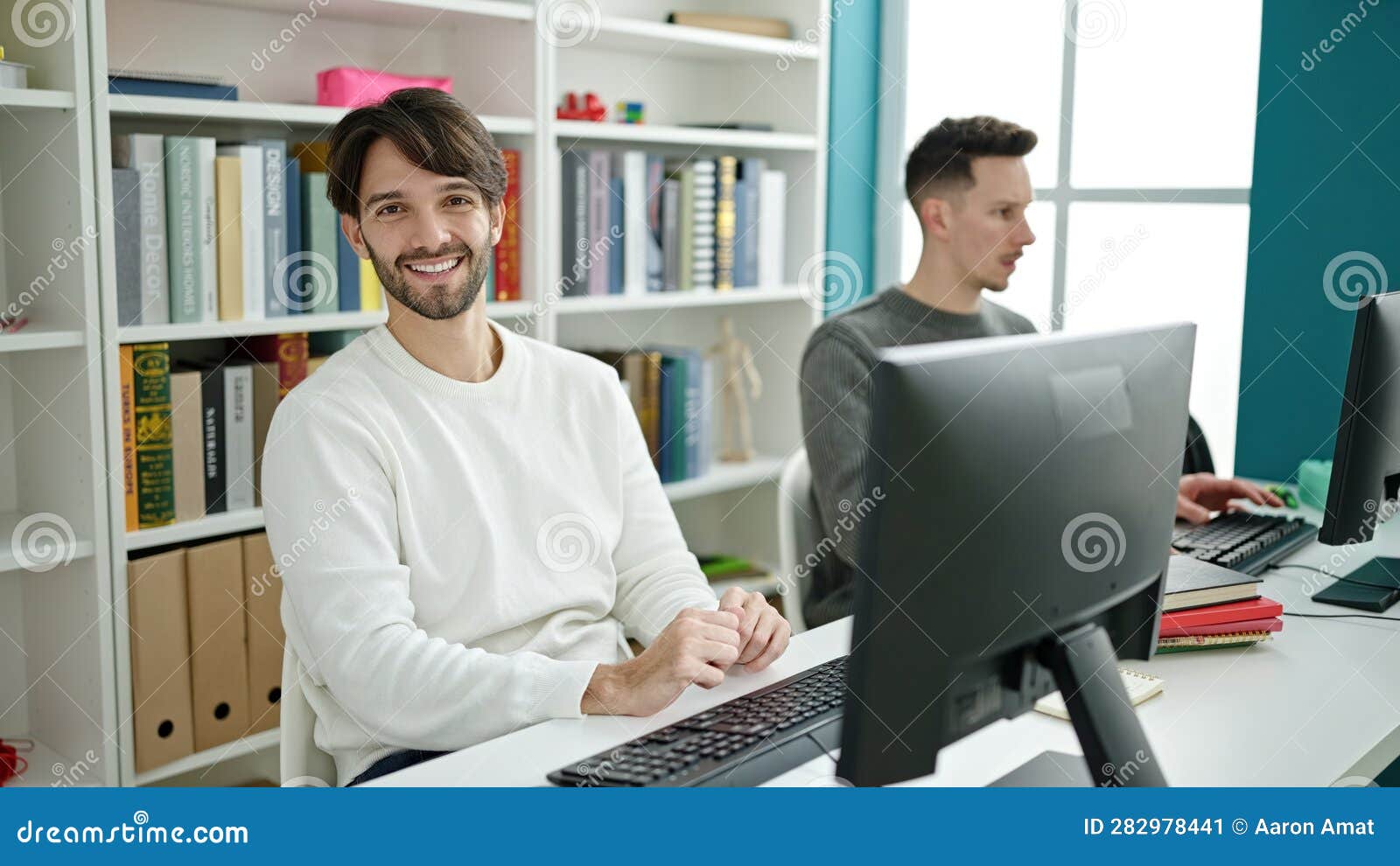 Two Men Students Using Computer Studying at Library University Stock ...