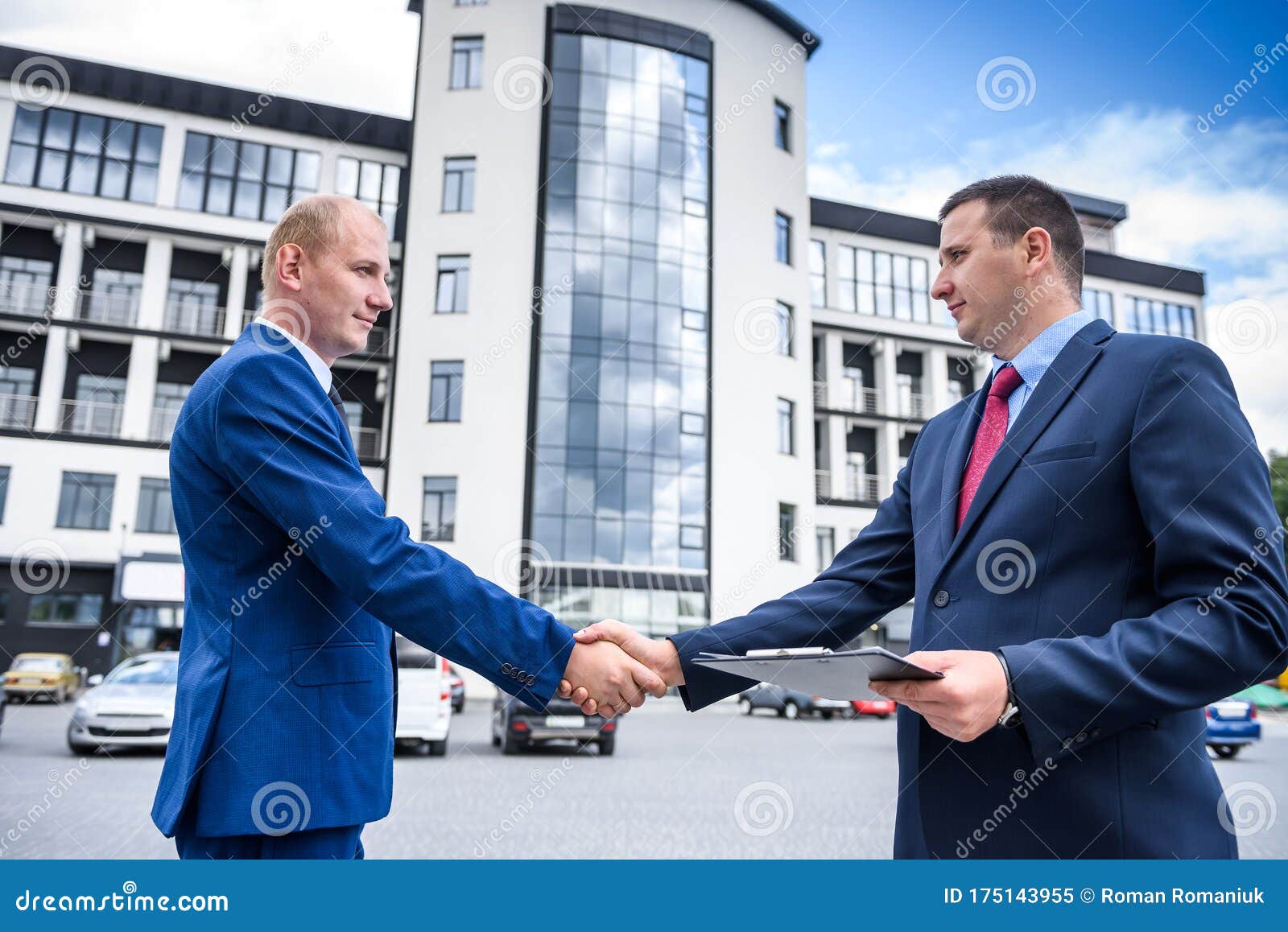 Two Men in Suits Handshaking Opposite Building Stock Image - Image of ...