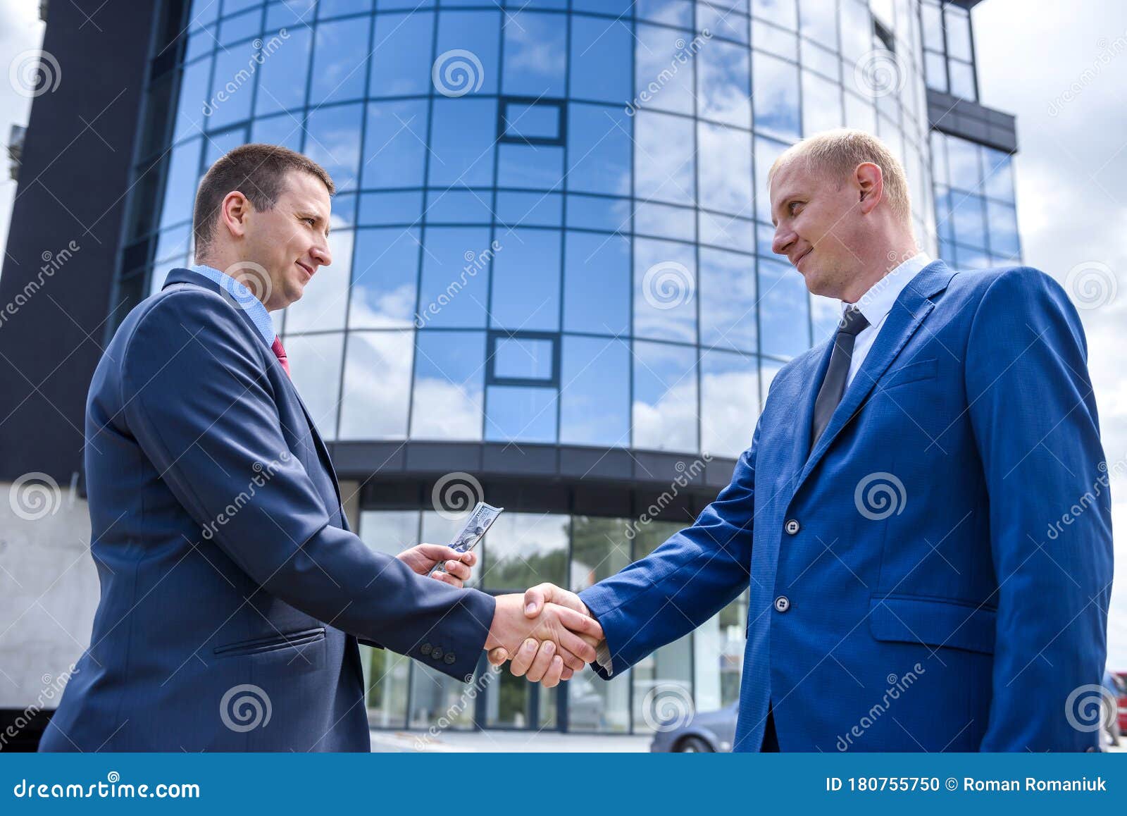 Two Men in Suits Handshaking Opposite Building Stock Photo - Image of ...