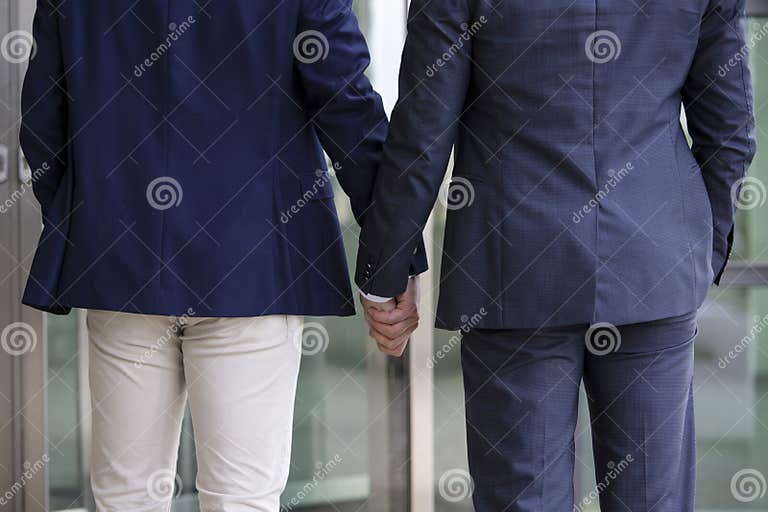 Two Men in Suits Holding Hands Stock Photo - Image of passion, date ...