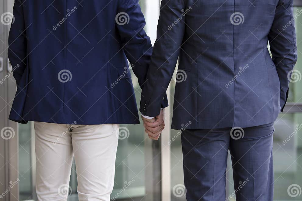 Two Men in Suits Holding Hands Stock Photo - Image of passion, date ...