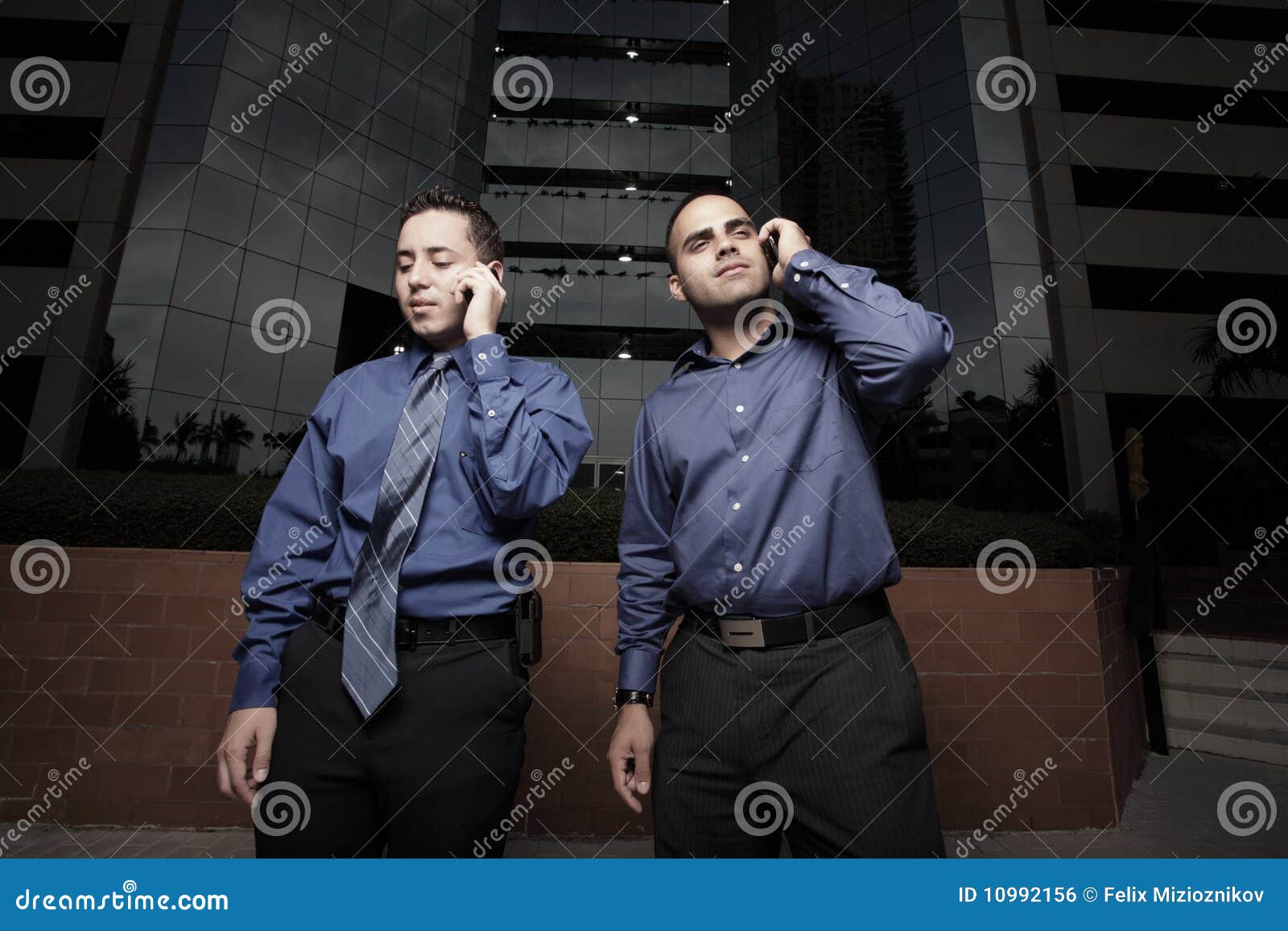 Two Men Talking on Cellphones Stock Photo - Image of people, talking ...