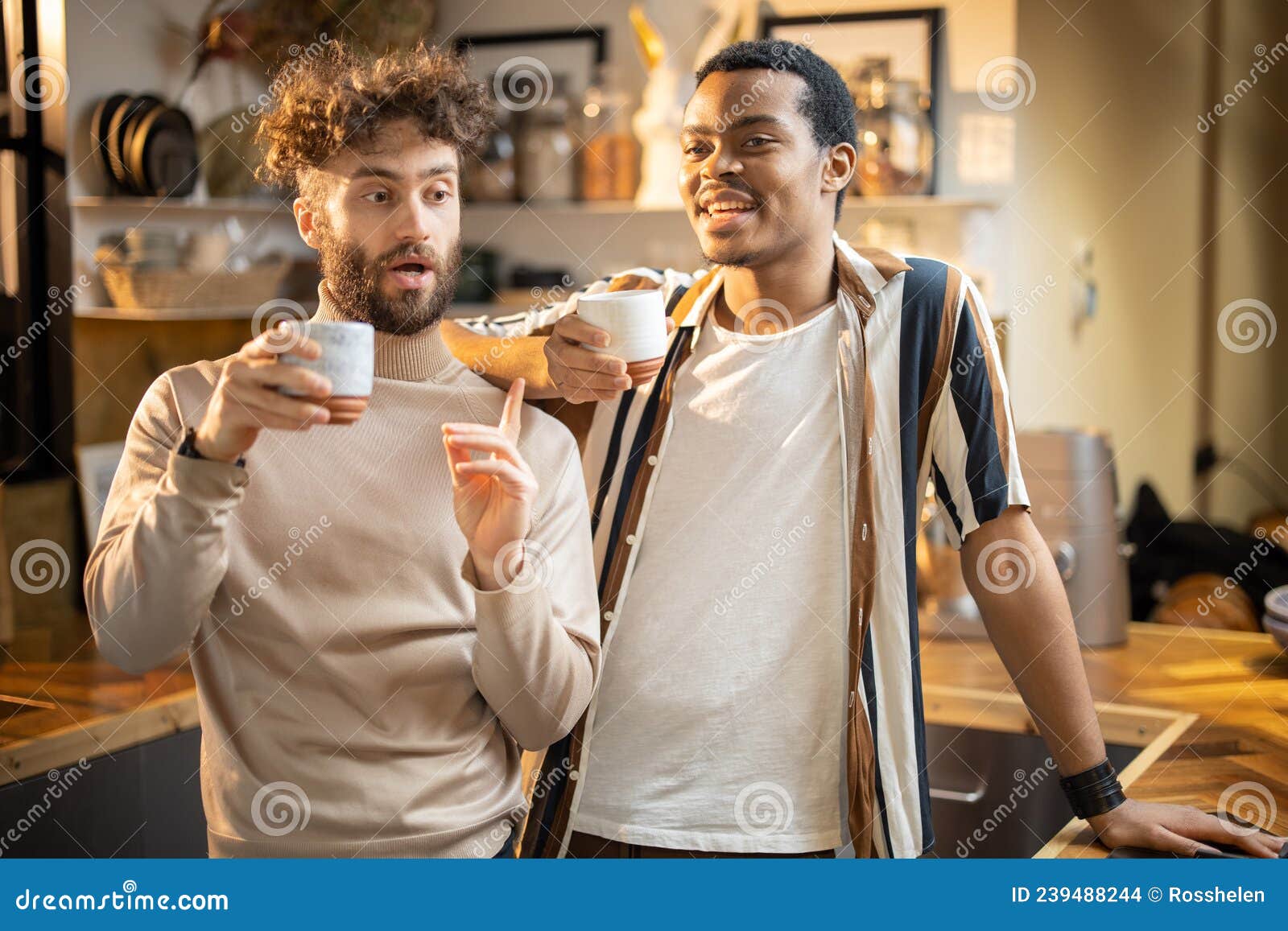 Two Men Talking and Drinking Coffee on Kitchen at Home Stock Photo ...