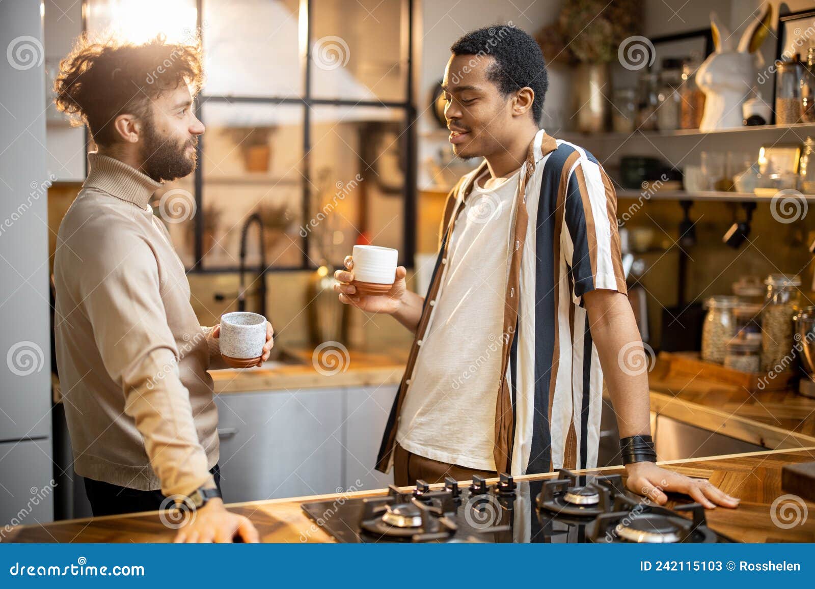 Two Men Talking and Drinking Coffee on Kitchen at Home Stock Image ...